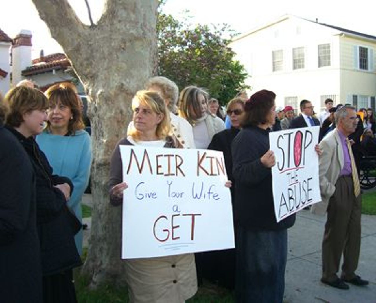 Protesters Rally Outside a Home as Debate Continues Over Best Get ...